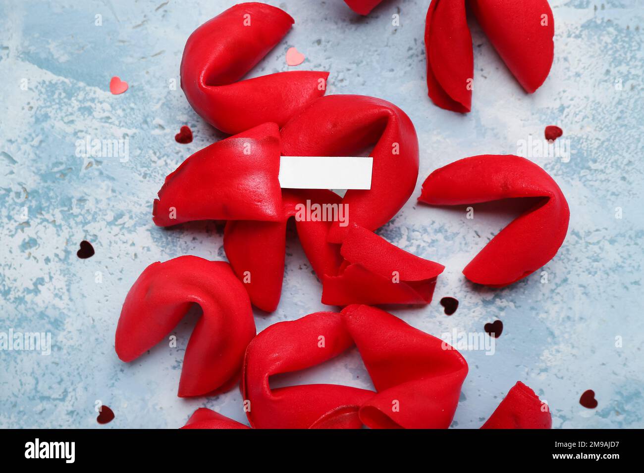 Red fortune cookies with hearts on grunge background, closeup ...