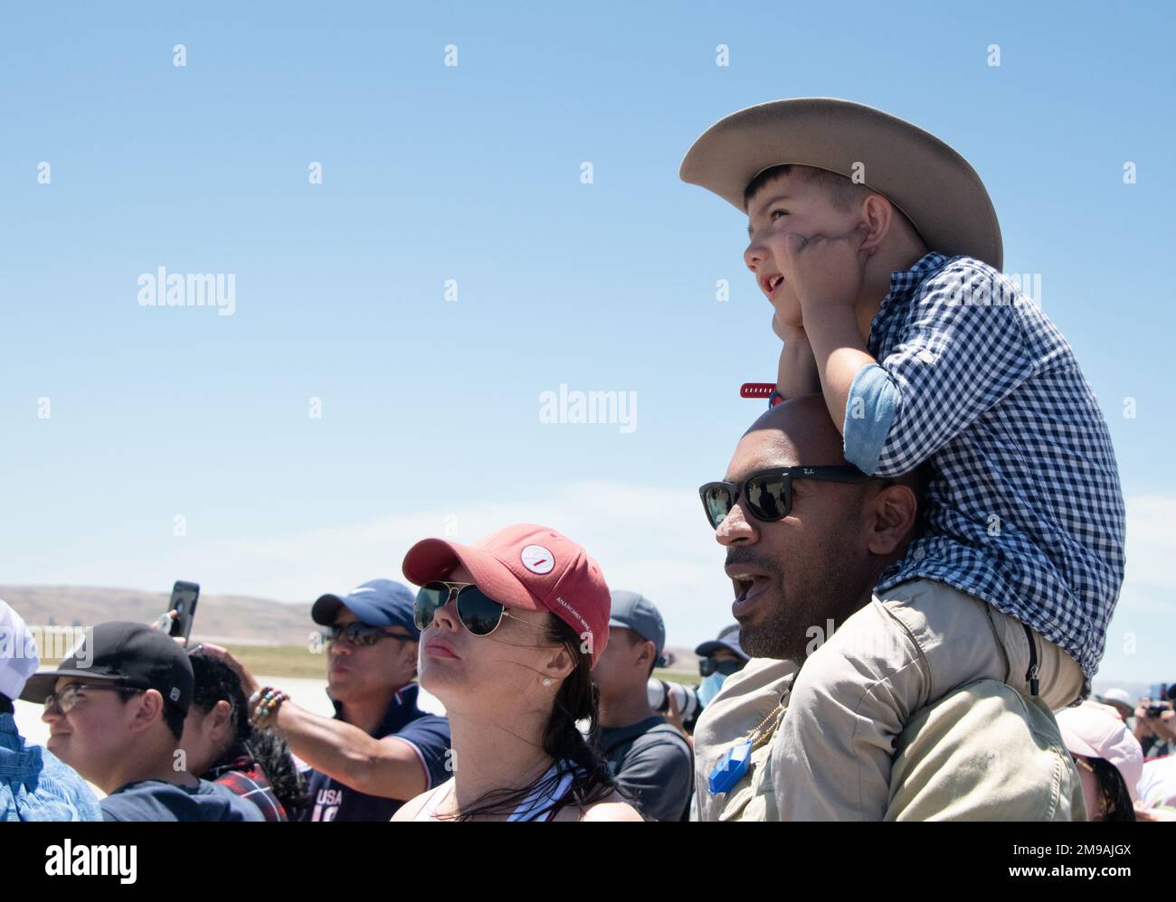 Members of the community watch an aerial demonstration at Travis Air ...