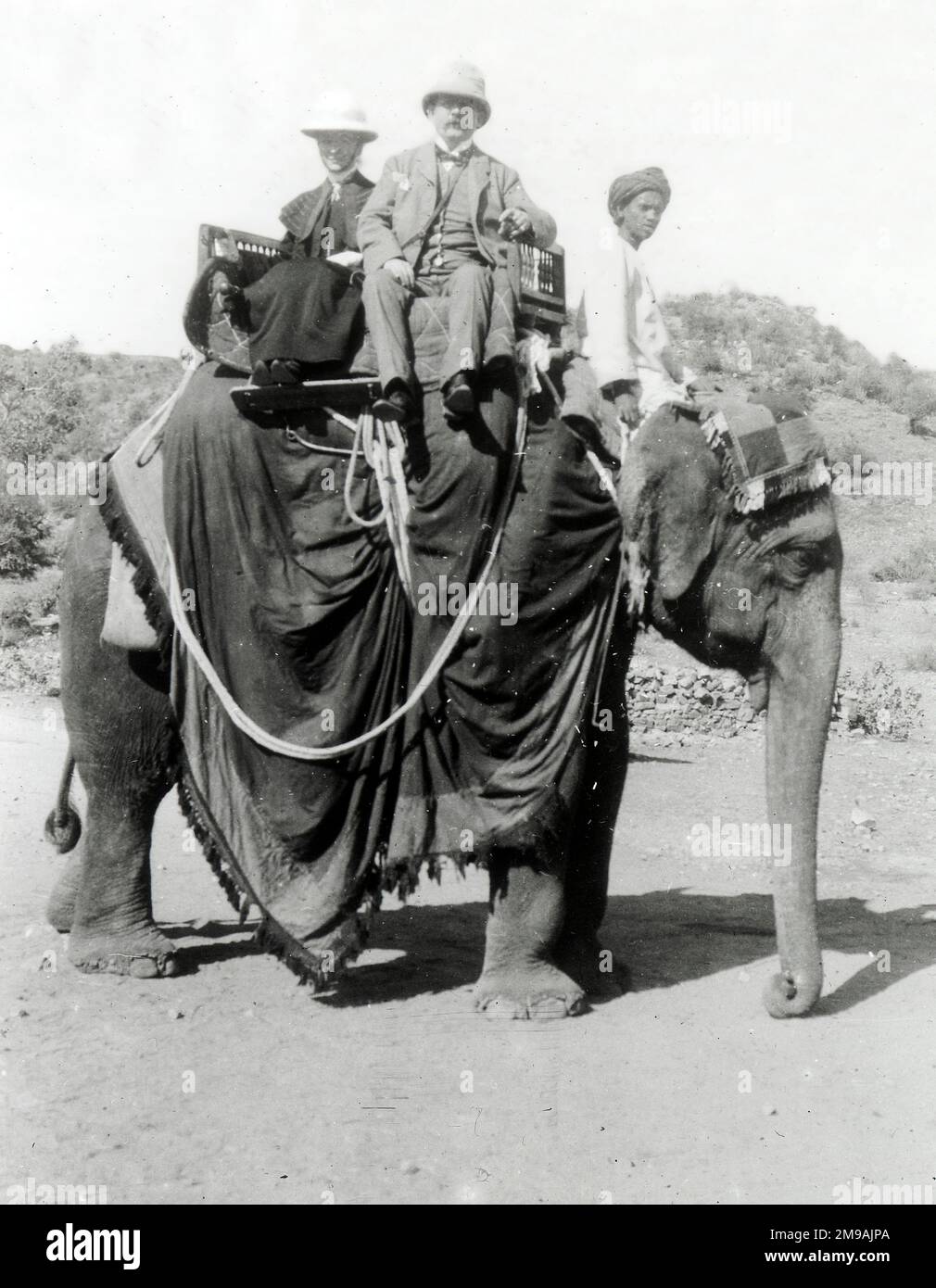 Colonial India, British gents ride on an elephant Stock Photo - Alamy