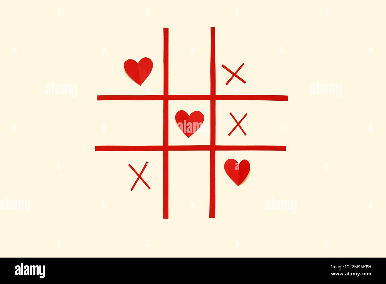 Tic tac toe game with paper hearts on color background. Valentines Day ...