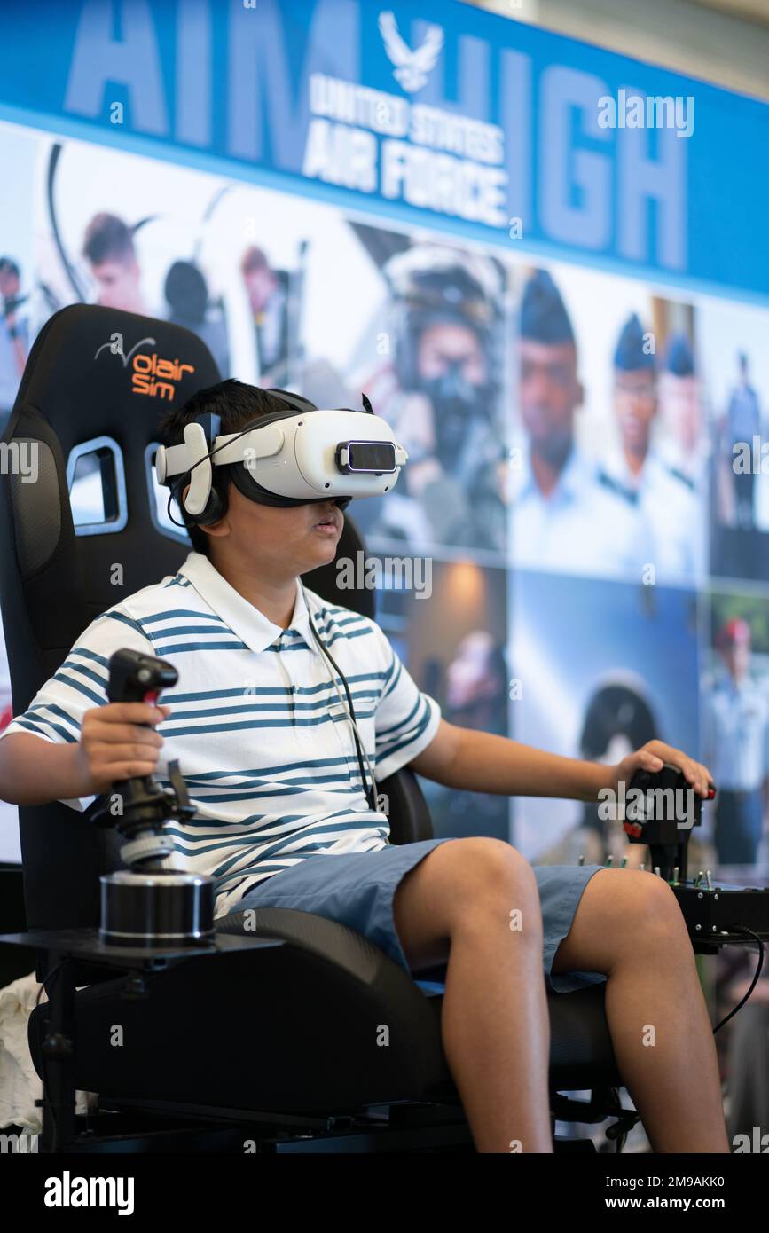 A child plays a virtual reality game at the Kids Zone during Wings Over ...