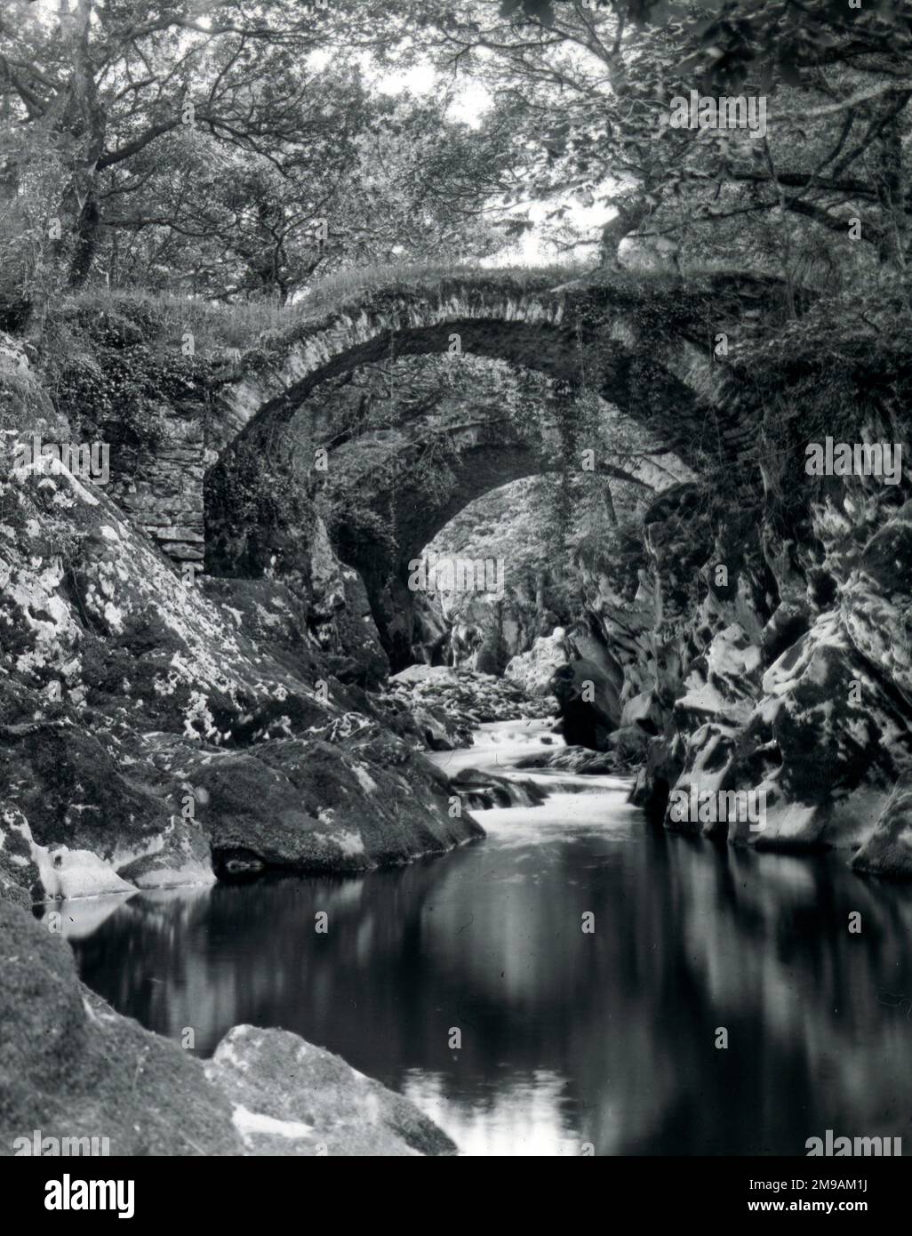 Roman packhorse bridge across the River Machno, Penmachno, Betws-y-Coed ...