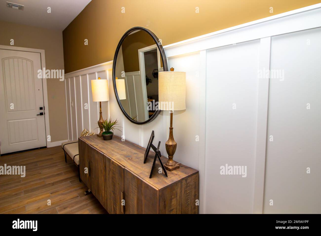 Home Entryway With Bench, Wooden Chest And Circular Mirror Stock Photo ...