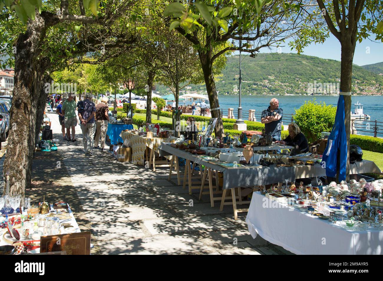 Italian flea market on the shores of Lake Maggiore Stock Photo - Alamy