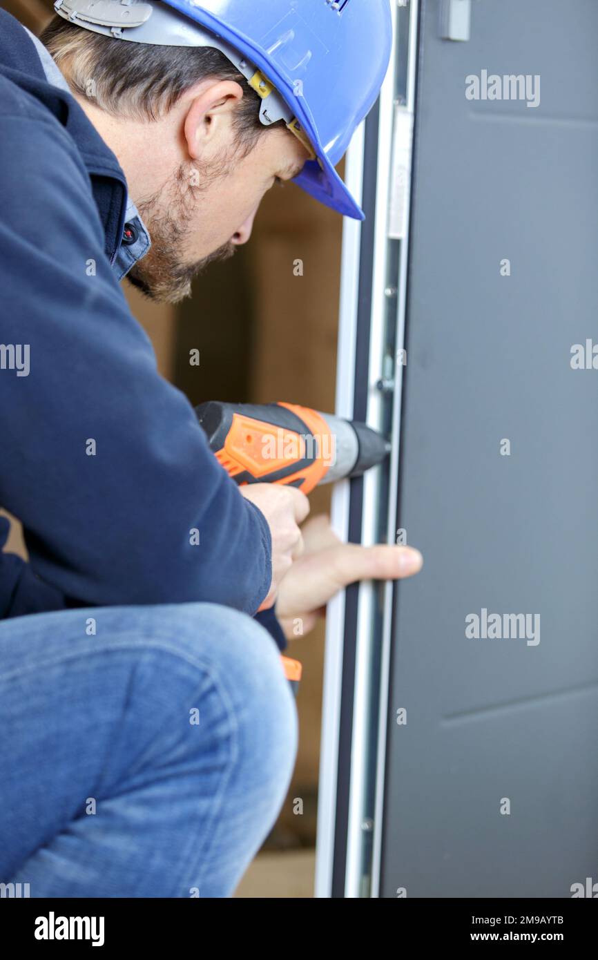a builder using cordless drill Stock Photo - Alamy