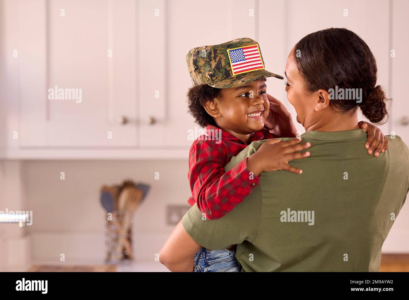 American Army Mother In Uniform Home On Leave Hugging Son Wearing Her ...