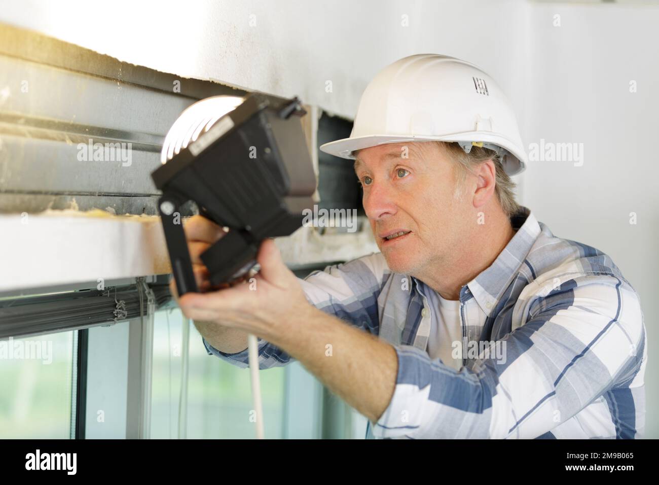 old man installing window blinds at home Stock Photo - Alamy