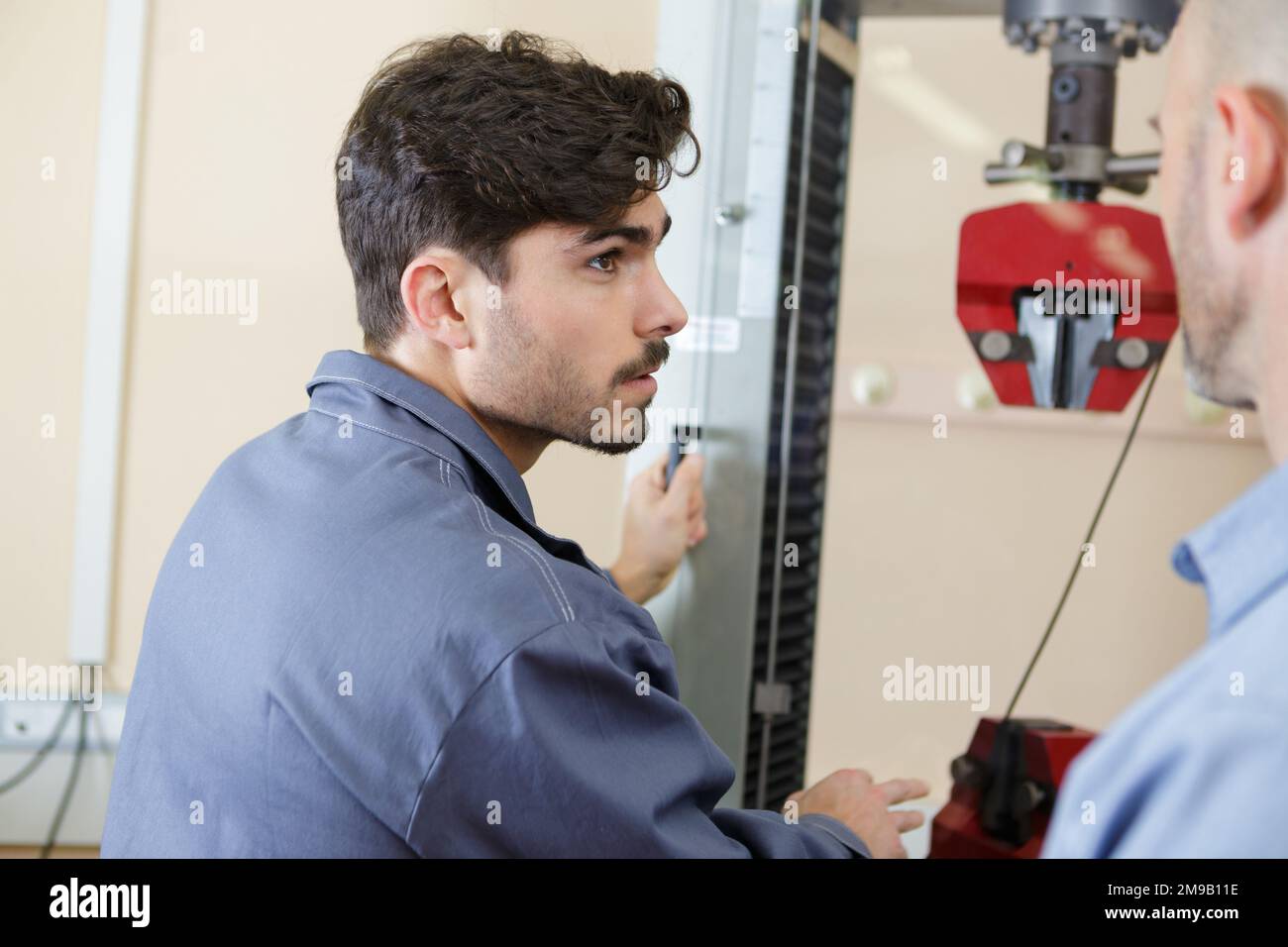 male engineer seeking approval from foreman before proceeding Stock ...