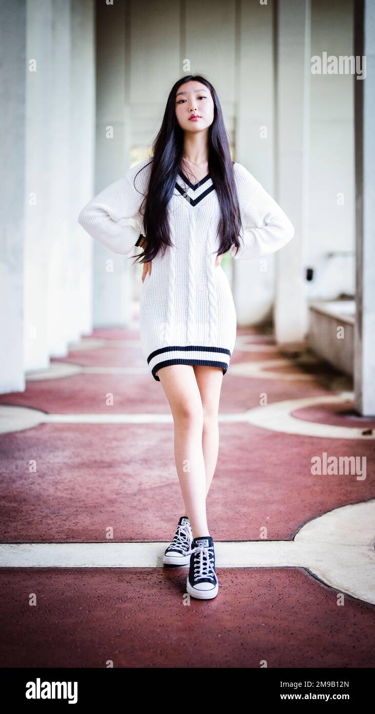 Teenage Girl Standing in Outdoor Walkway Late Afternoon Stock Photo - Alamy