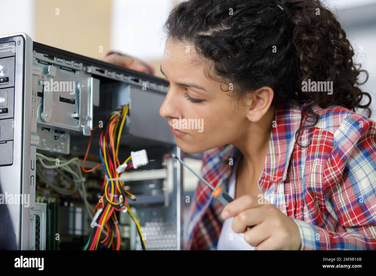 cute female engineer at home working on technology Stock Photo - Alamy