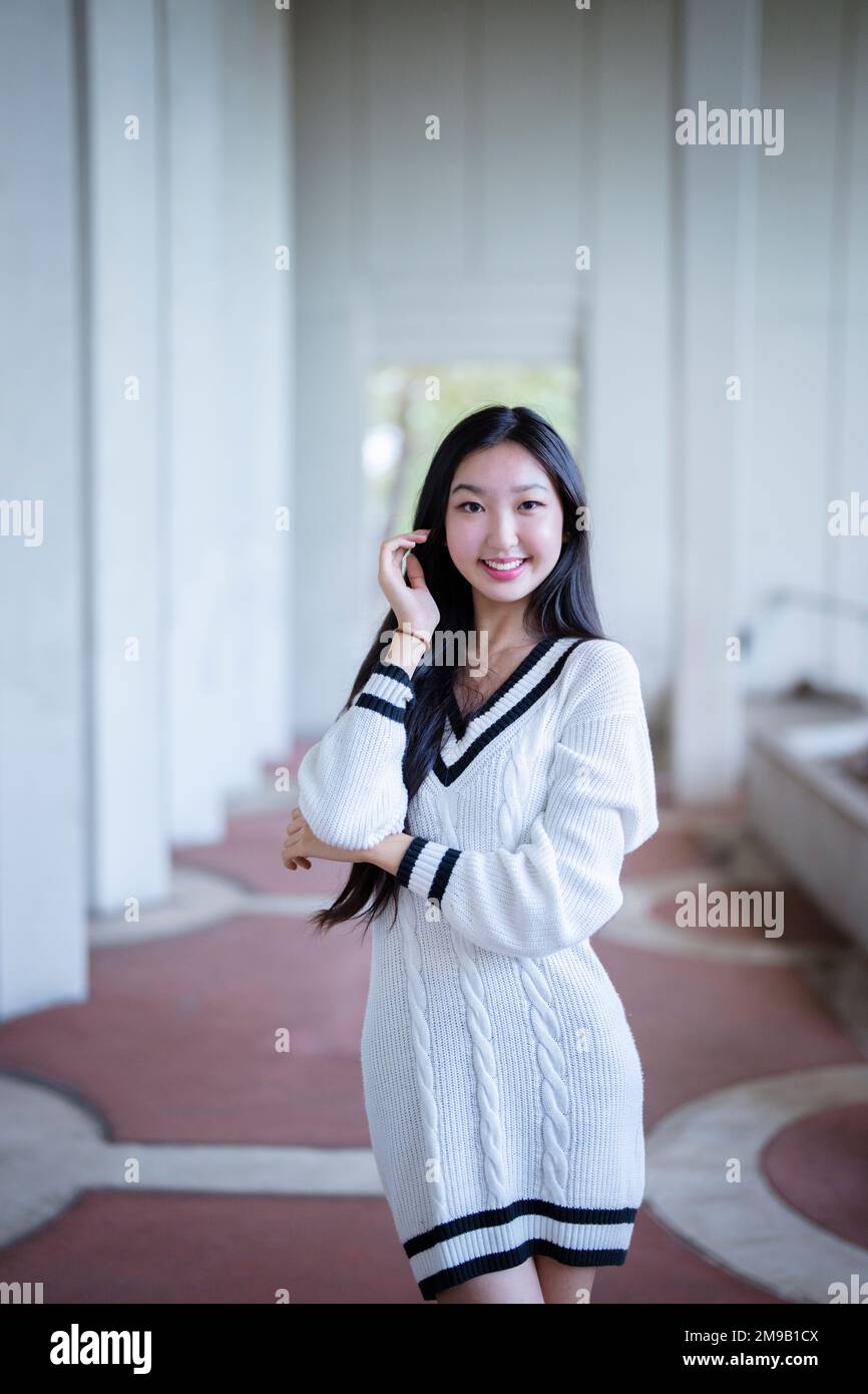 Teenage Girl Standing in Outdoor Walkway Late Afternoon Stock Photo - Alamy