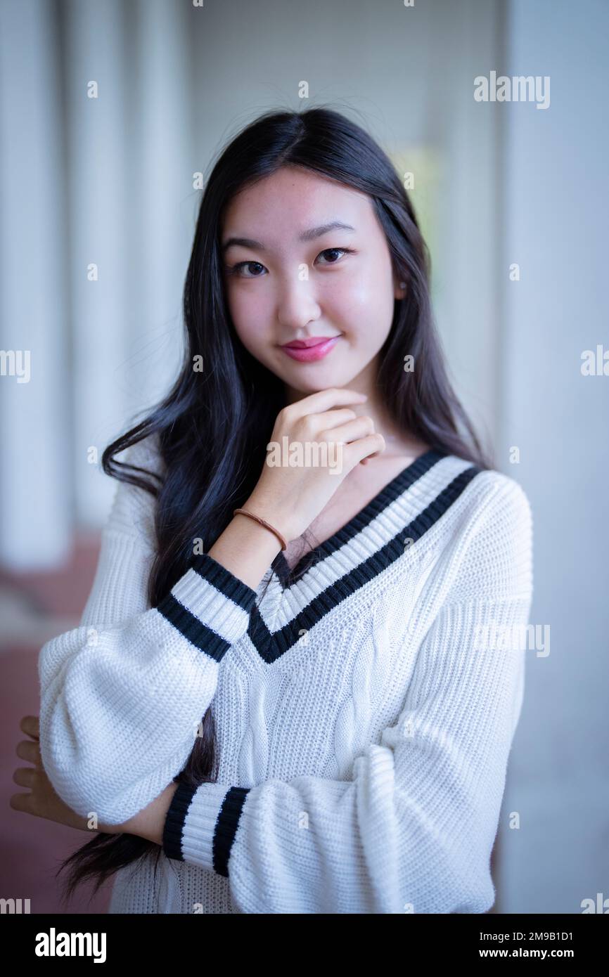 Teenage Girl Standing in Outdoor Walkway Late Afternoon Stock Photo - Alamy