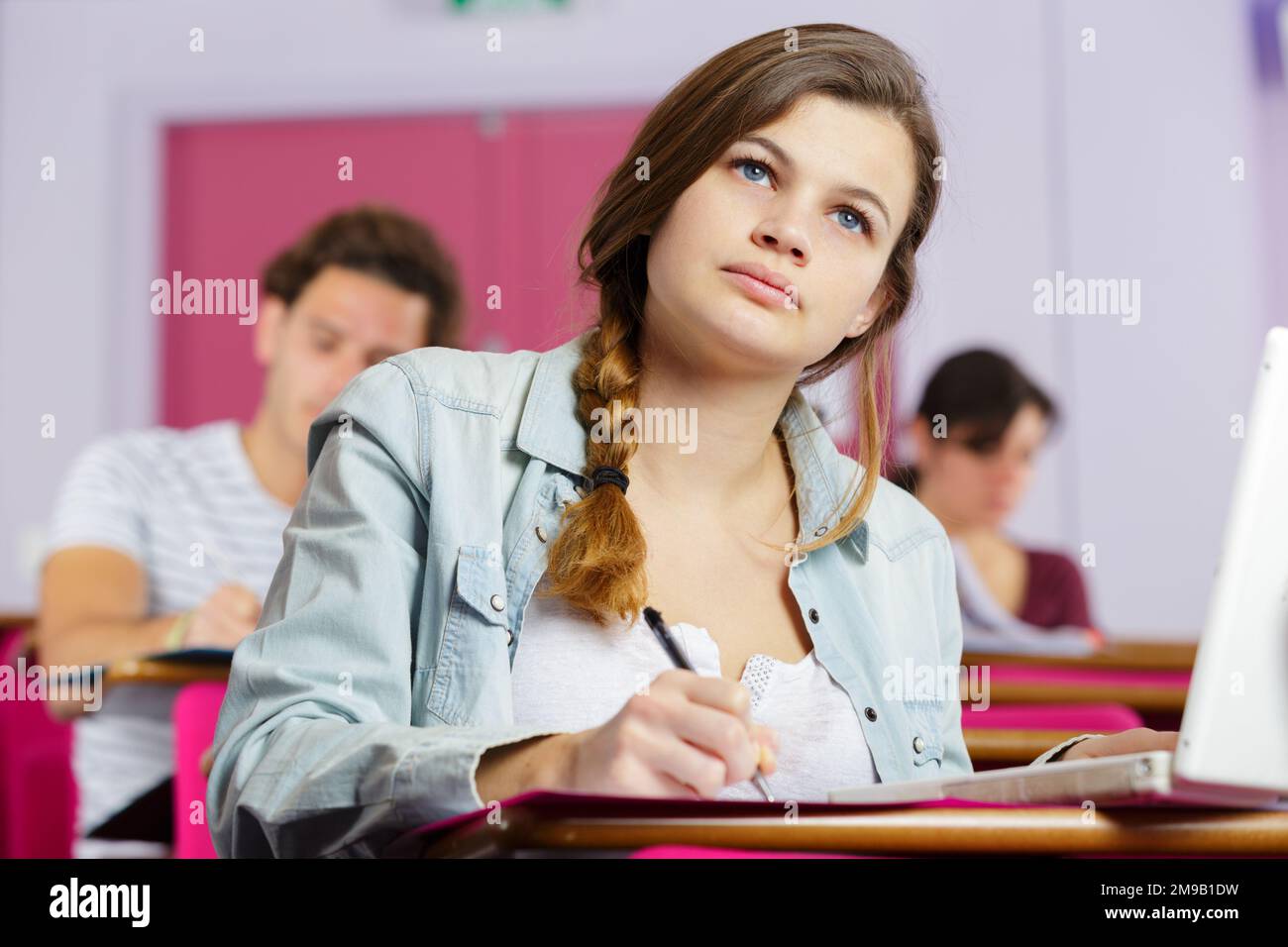female student with a laptop in classroom Stock Photo - Alamy
