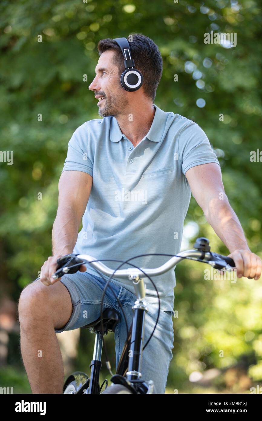 man on bike outdoors smiling Stock Photo - Alamy