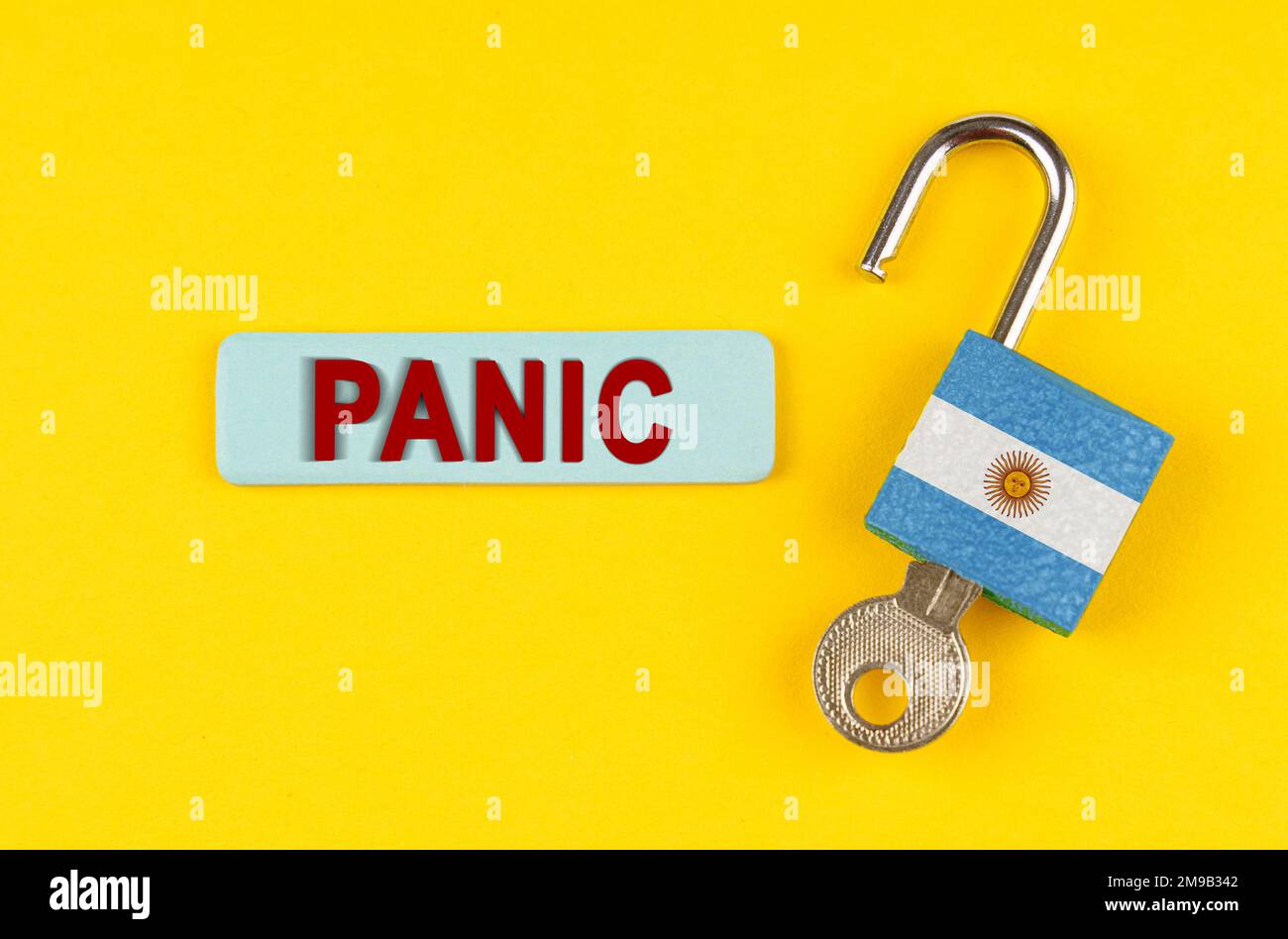 On a yellow surface, an open lock with the image of the flag of ...