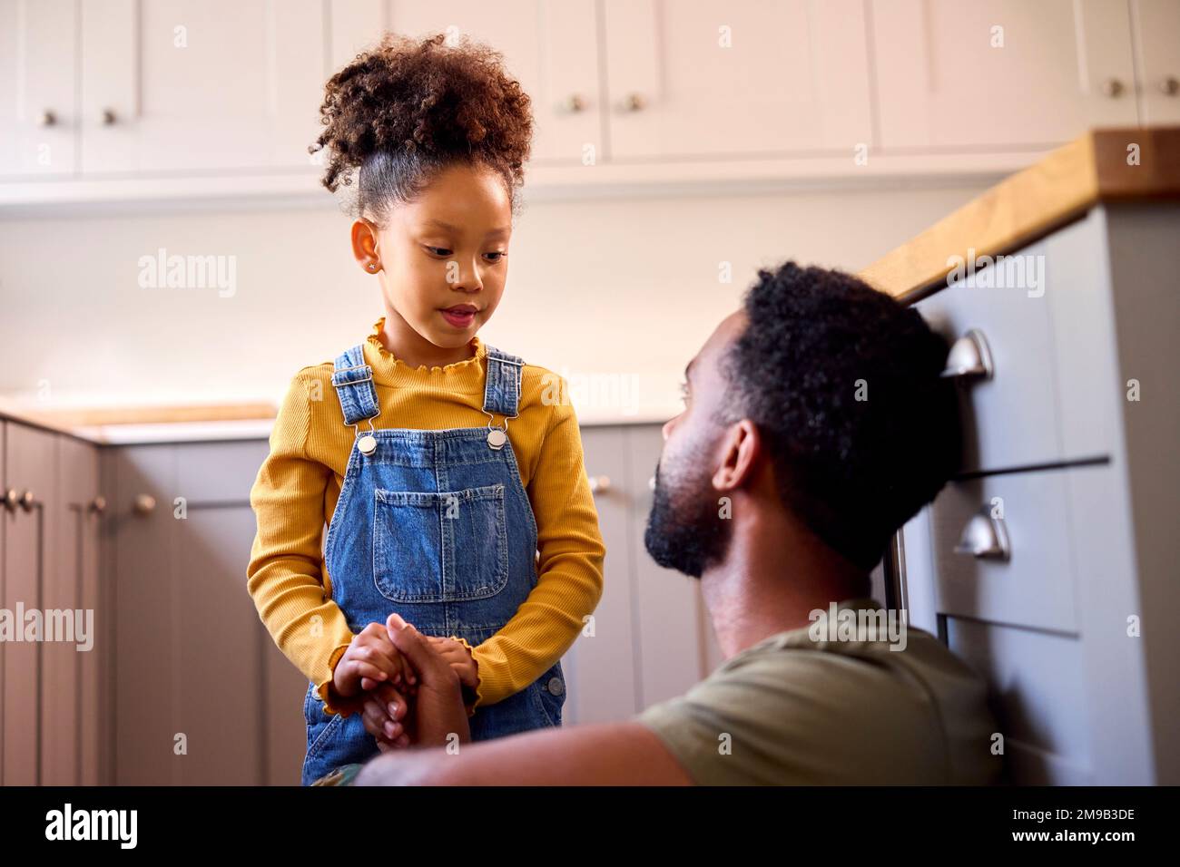 Daughter Comforting Depressed Father In Uniform Suffering With PTSD ...