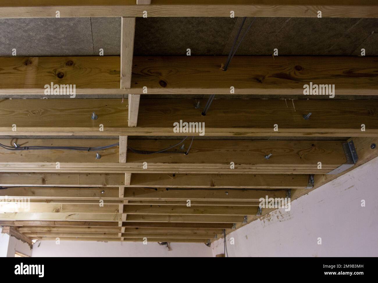 New ceiling rafters with first fix electrics before plasterboard ...
