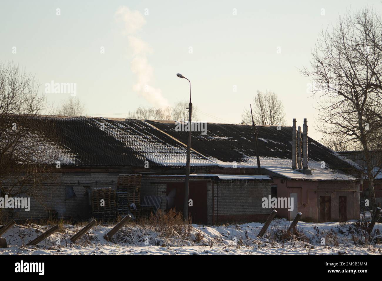 Industrial building in winter. Roof in snow. View of poultry farm ...