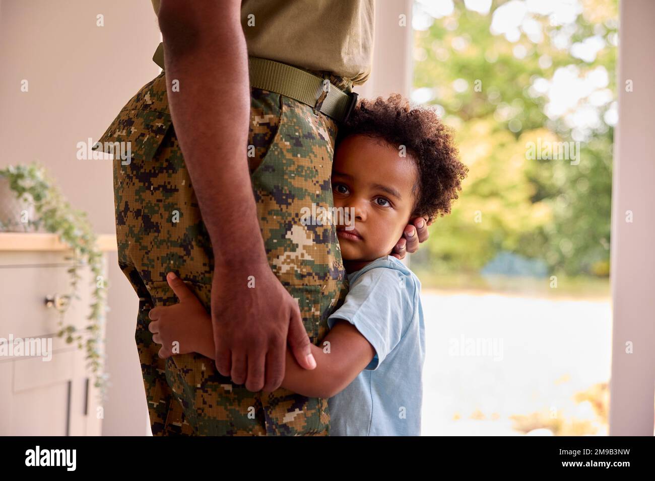 Close Up Of Loving Son Hugging Army Father In Uniform Home On Leave Stock Photo - Alamy