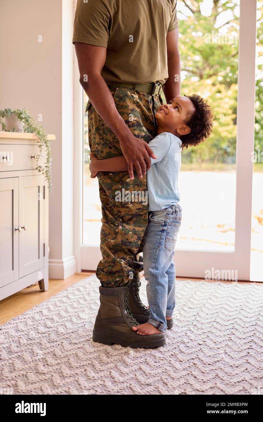 Close Up Of Loving Army Father In Uniform Home On Leave With Son ...