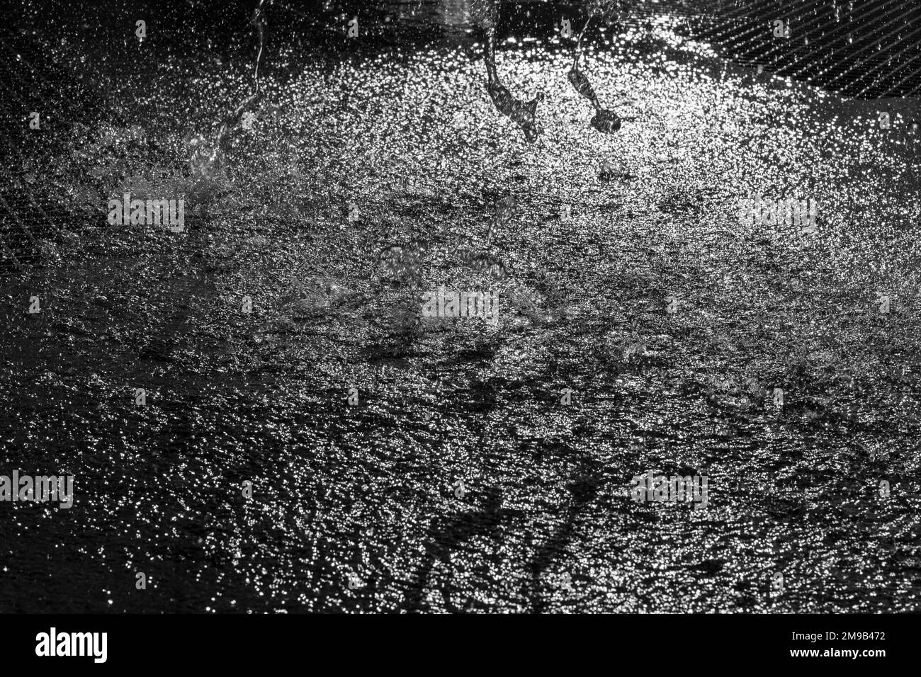 Spray of water. Water flies in different directions. Wet surface ...