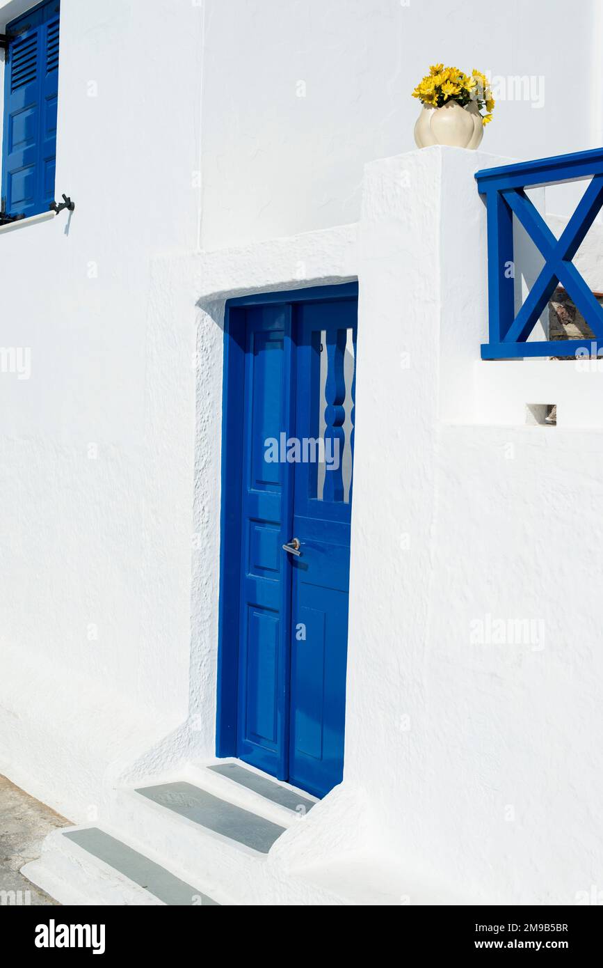 Entrance to a house on the Greek island of Santorini showing blue door ...