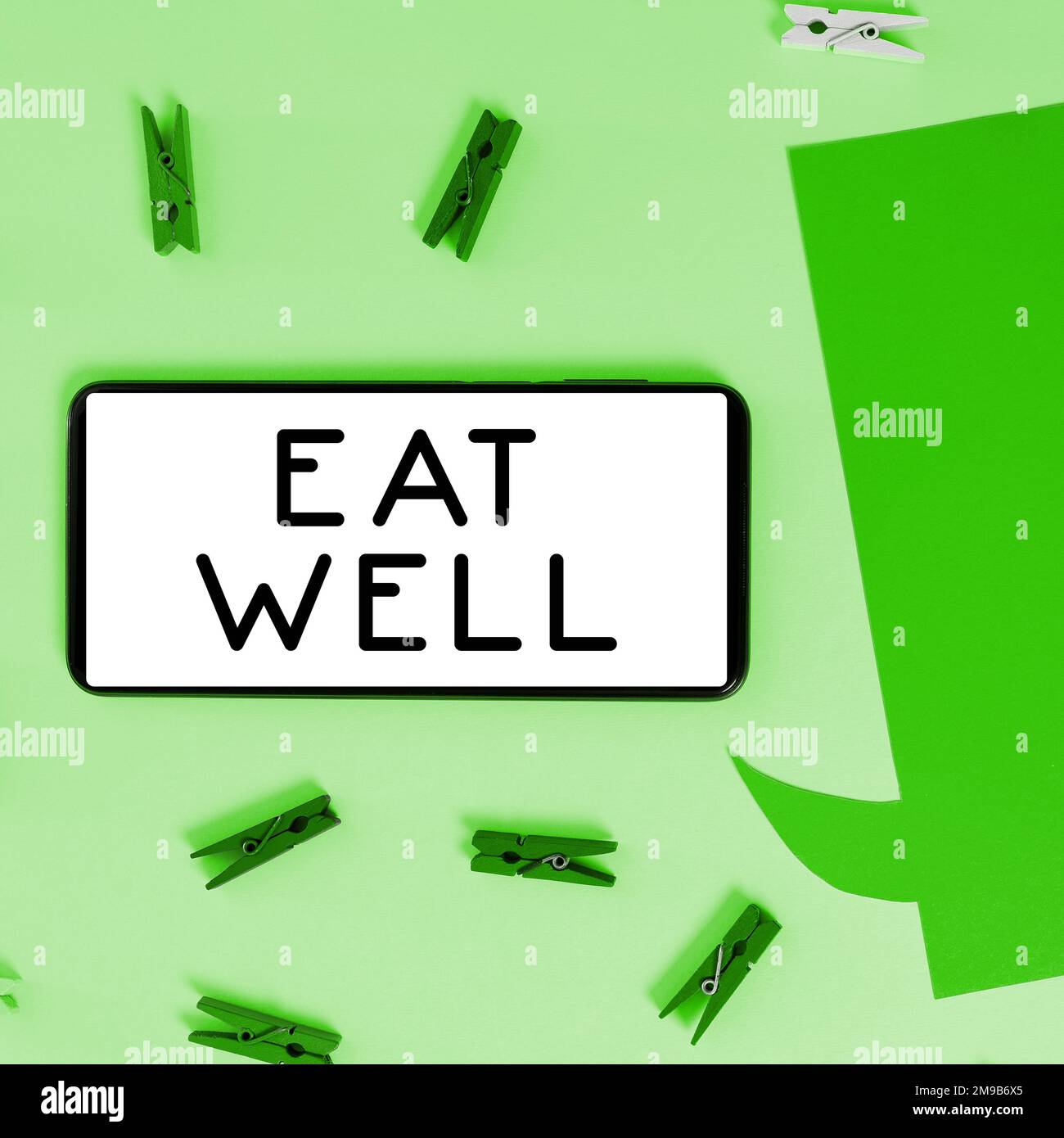 Hand writing sign Eat Well. Word for Practice of eating only foods that ...