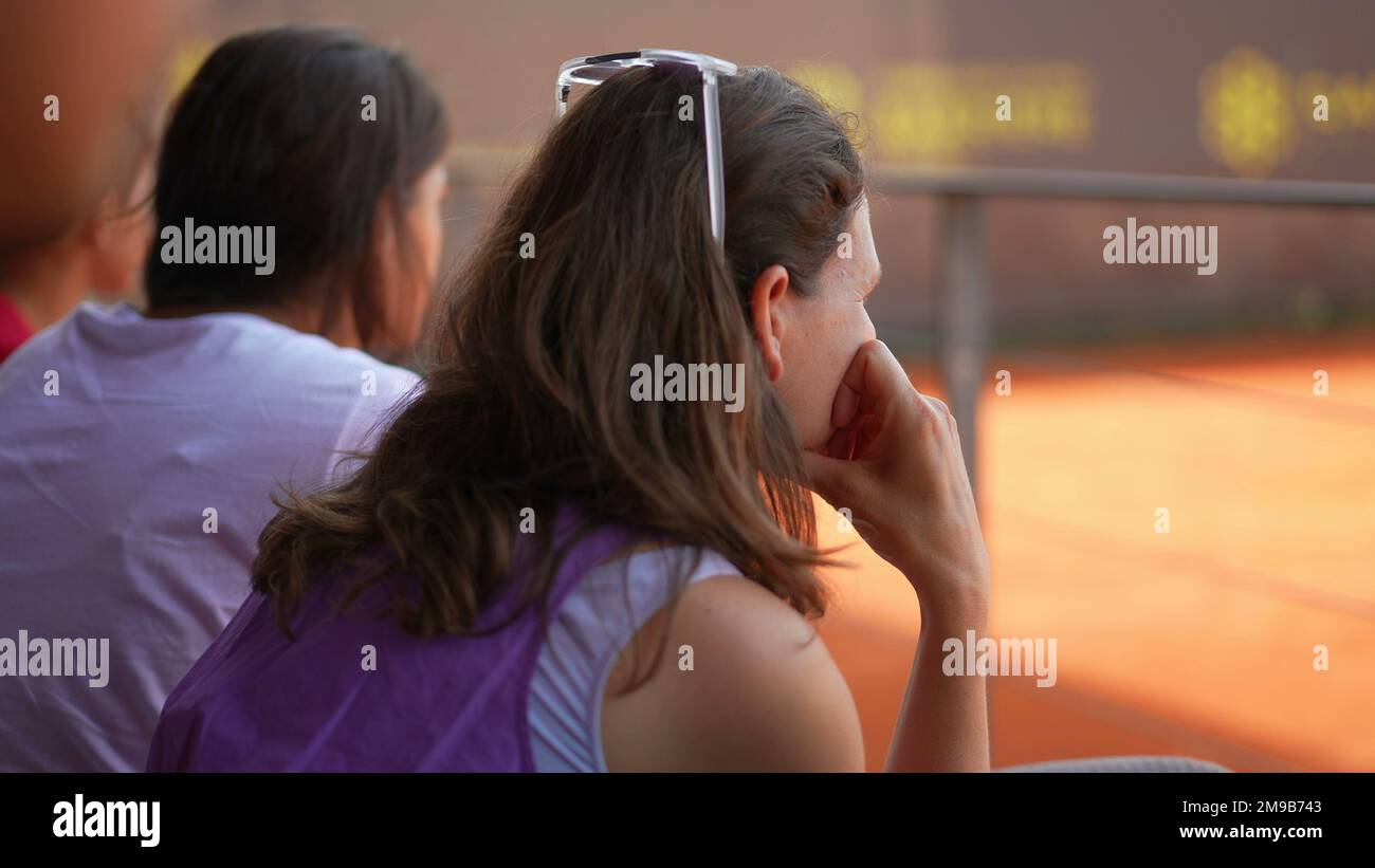 Woman watching tennis match. Spectators watching sport game Stock Photo ...