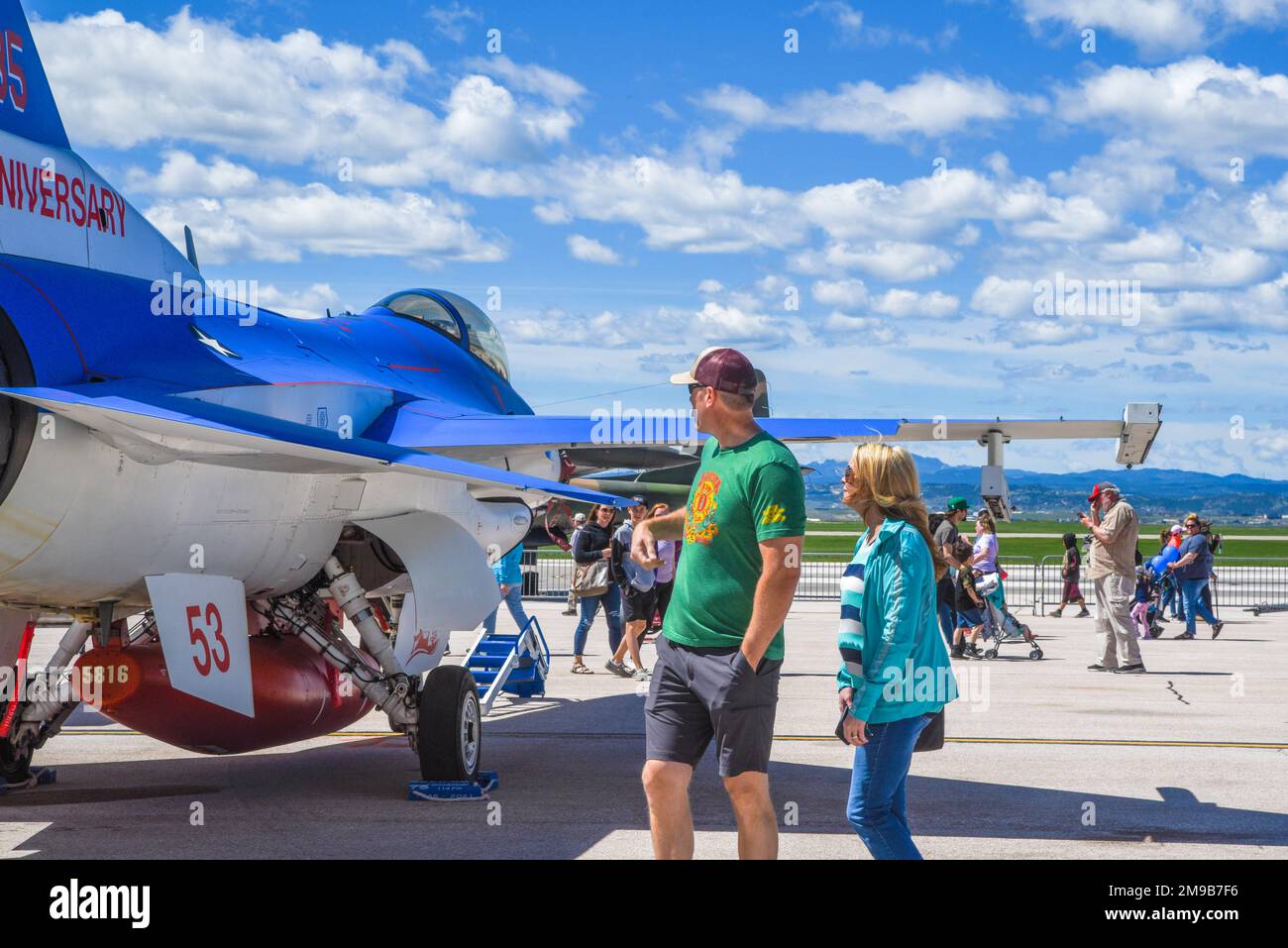 Visitors admire a F-16 Fighting Falcon static display at the 2022 ...