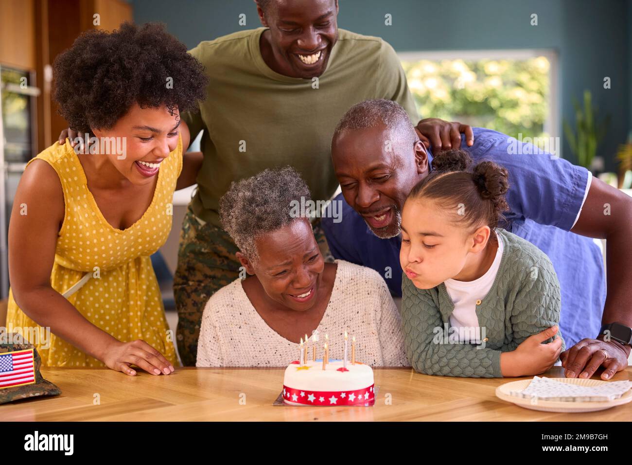 Multi-Generation Family With Military Father Celebrating Birthday With ...