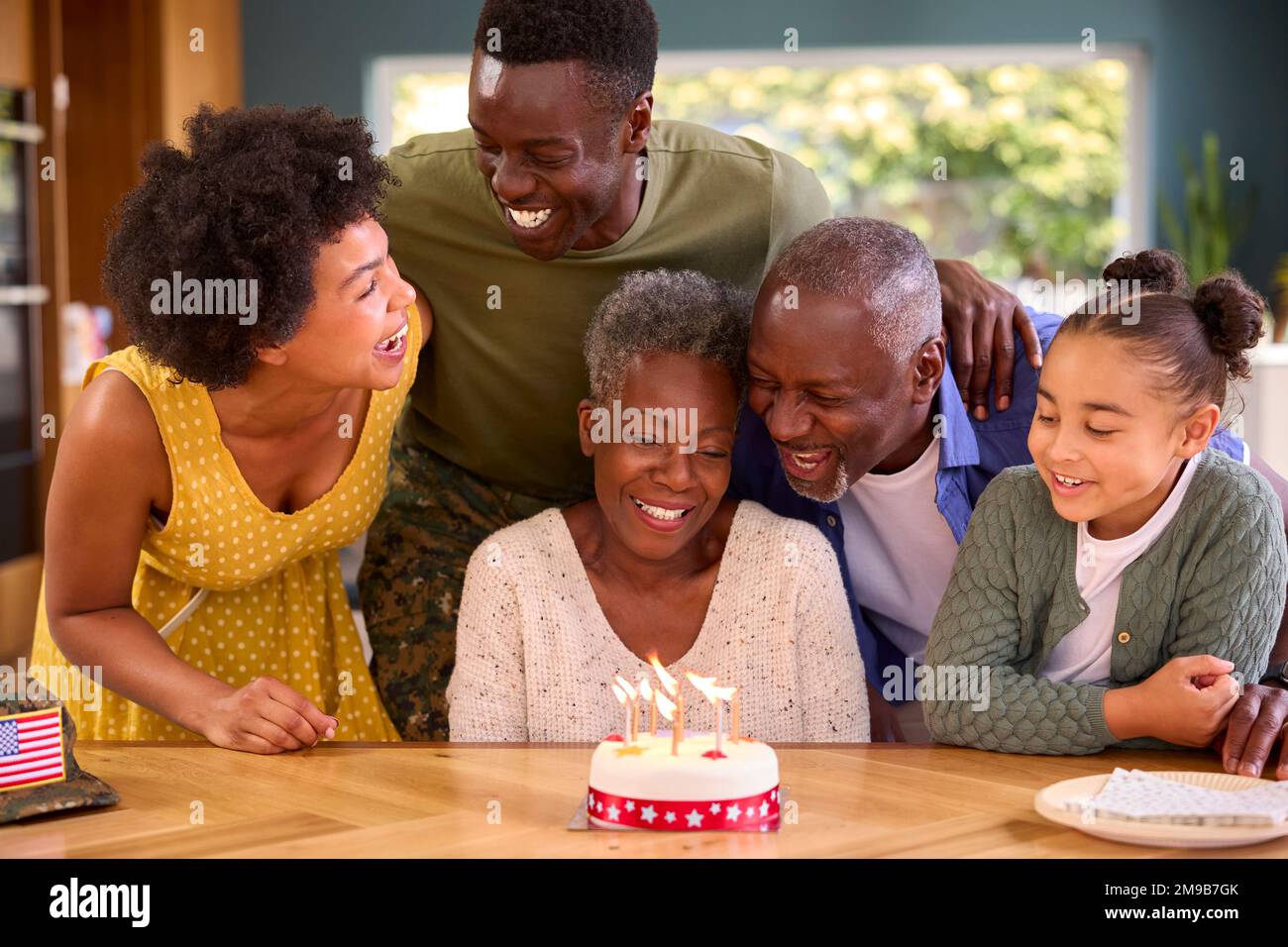 Multi-Generation Family With Military Father Celebrating Birthday With ...