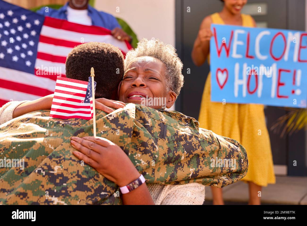 Multi-Generation Family With Parents And Wife Welcoming Army Soldier ...