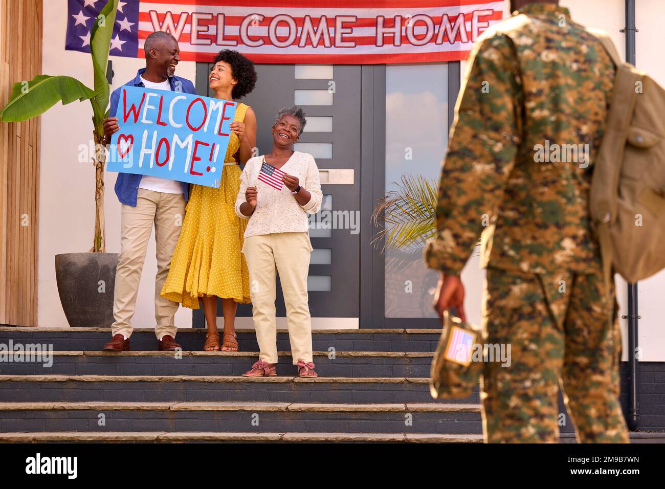 Multi-Generation Family With Parents And Wife Welcoming Army Soldier ...