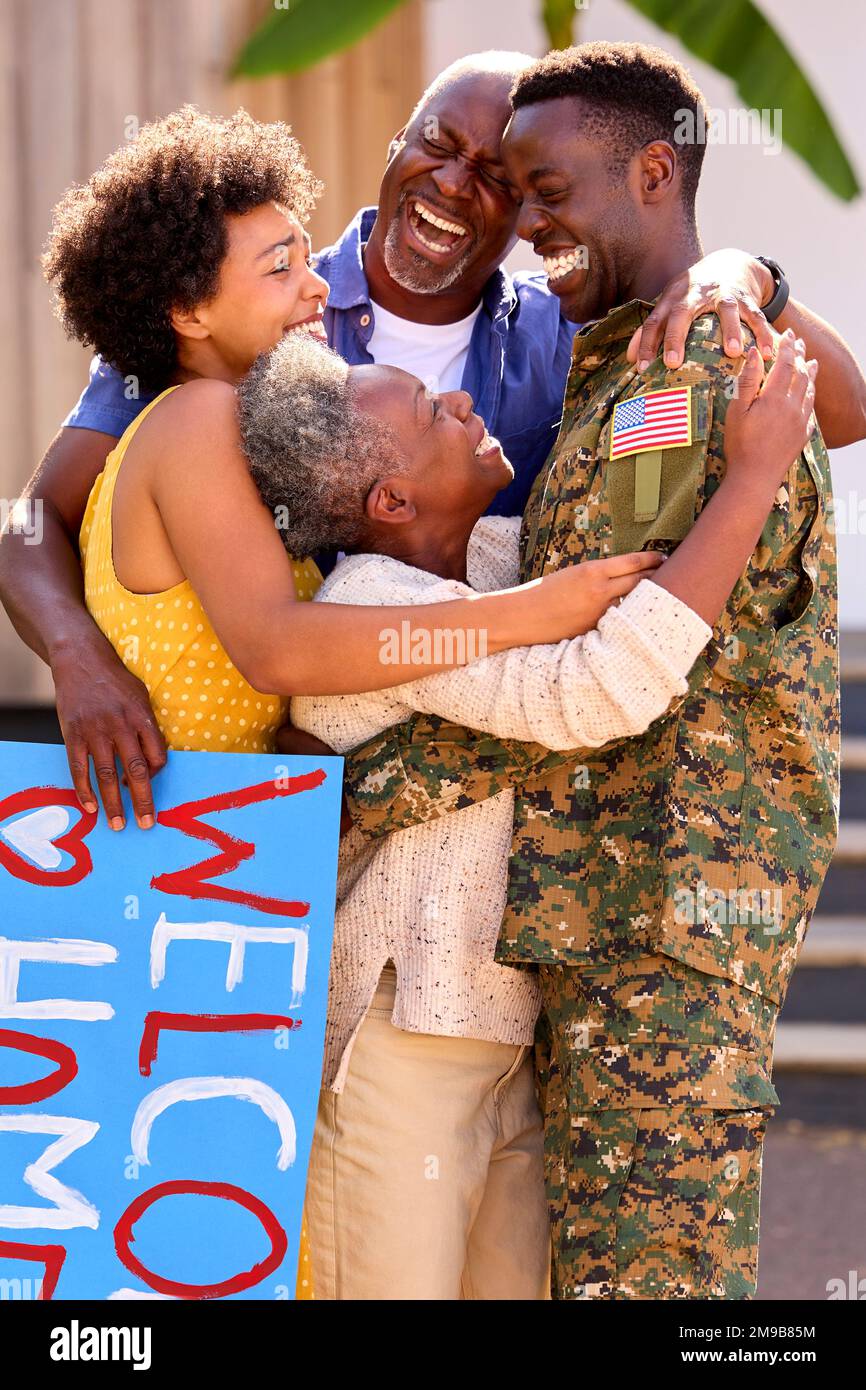 Multi-Generation Family With Parents And Wife Welcoming Army Soldier ...