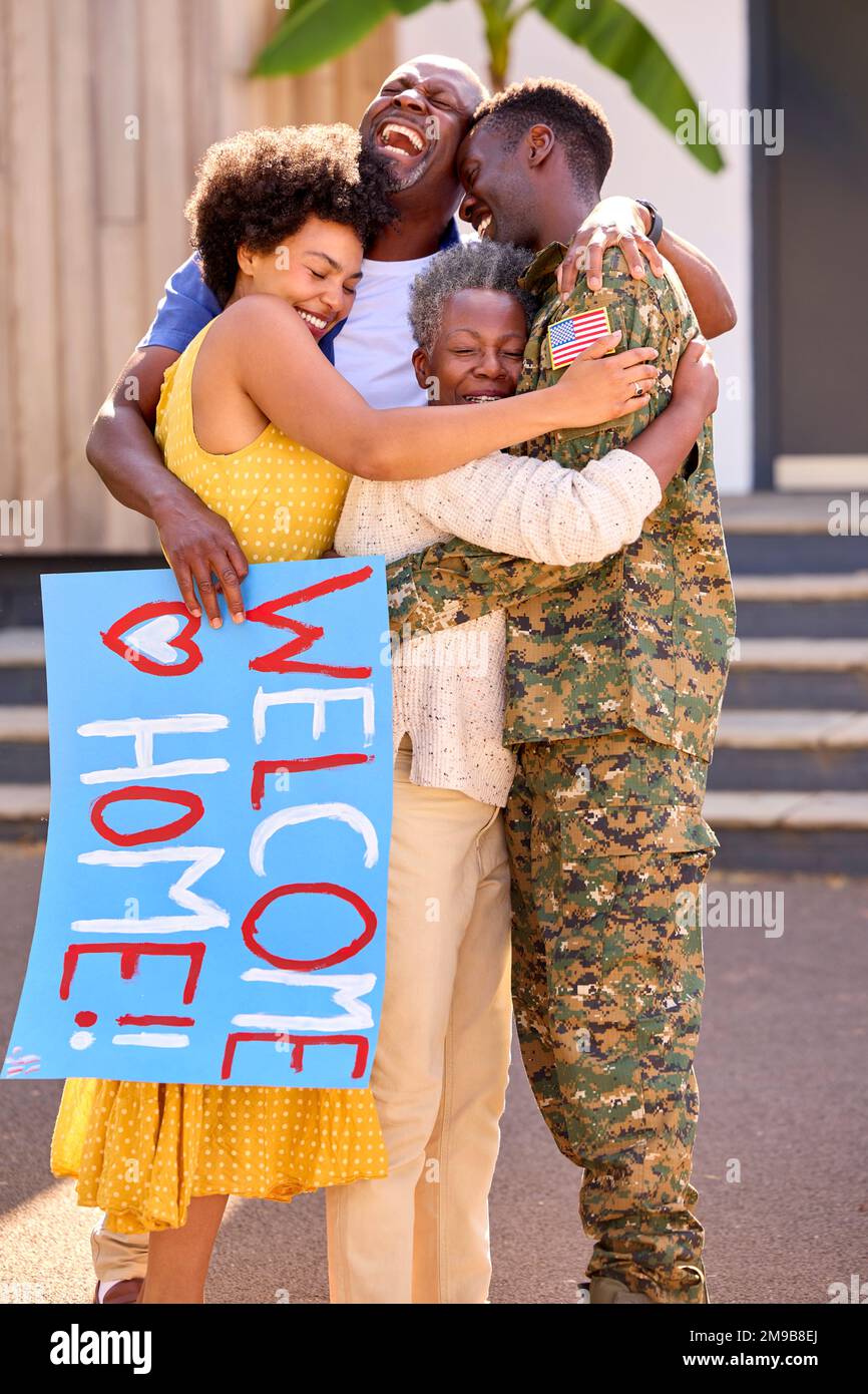 Multi-Generation Family With Parents And Wife Welcoming Army Soldier ...