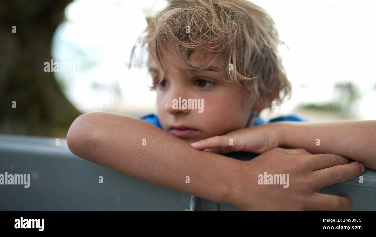 Thoughtful little kid. Pensive contemplative child portrait face close ...
