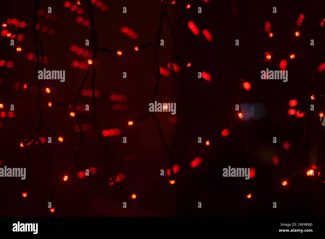 Red dots in space. Lights in dark. Red light bulbs. Lot of small lights ...