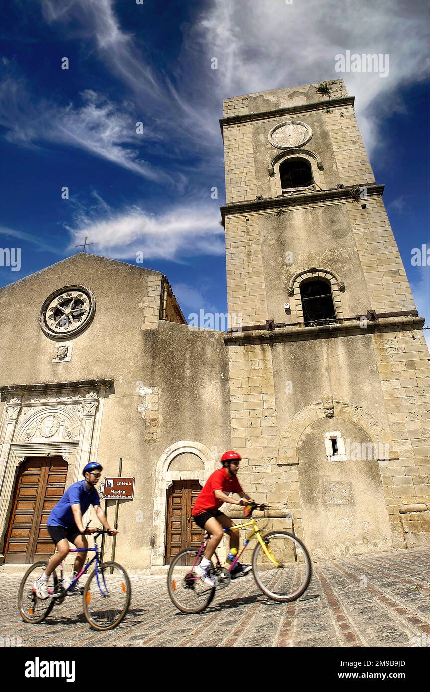Italy Sicily Savoca Chiesa Madre and cyclists Stock Photo - Alamy