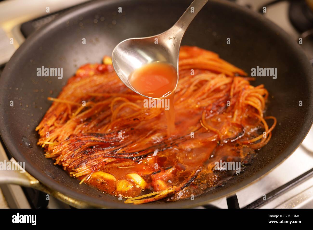 Spaghetti all'Assassina, Italian Puglia traditional pasta Stock Photo ...