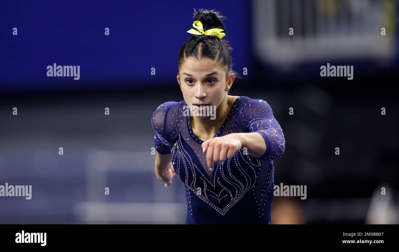 Michigan's Reyna Guggino competes in the floor during an NCAA ...