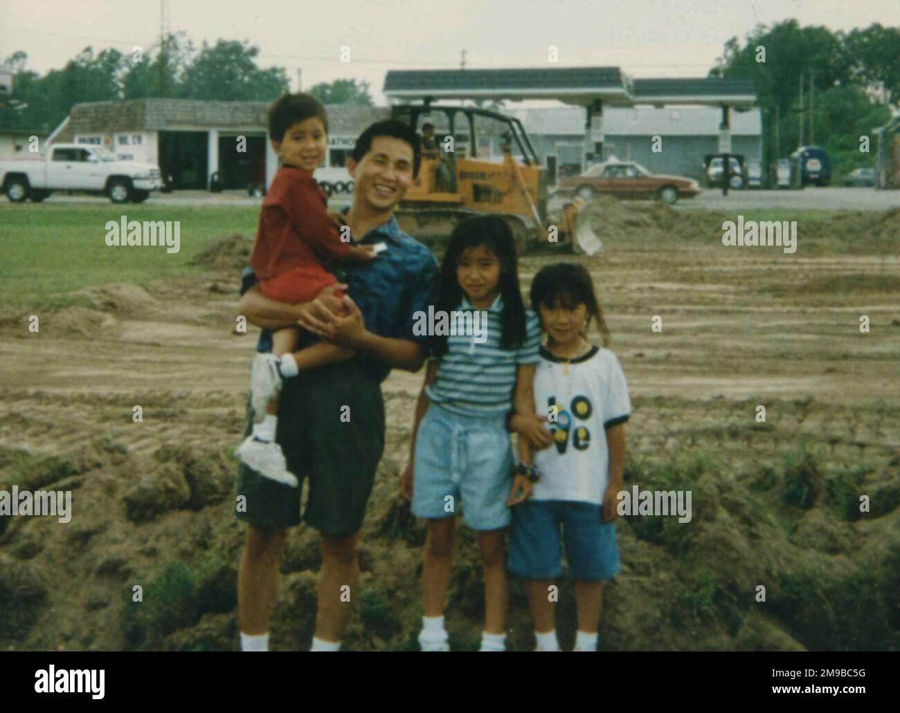 BAD AXE, Chun Siev (standing, left), 2022. © IFC Films / Courtesy ...