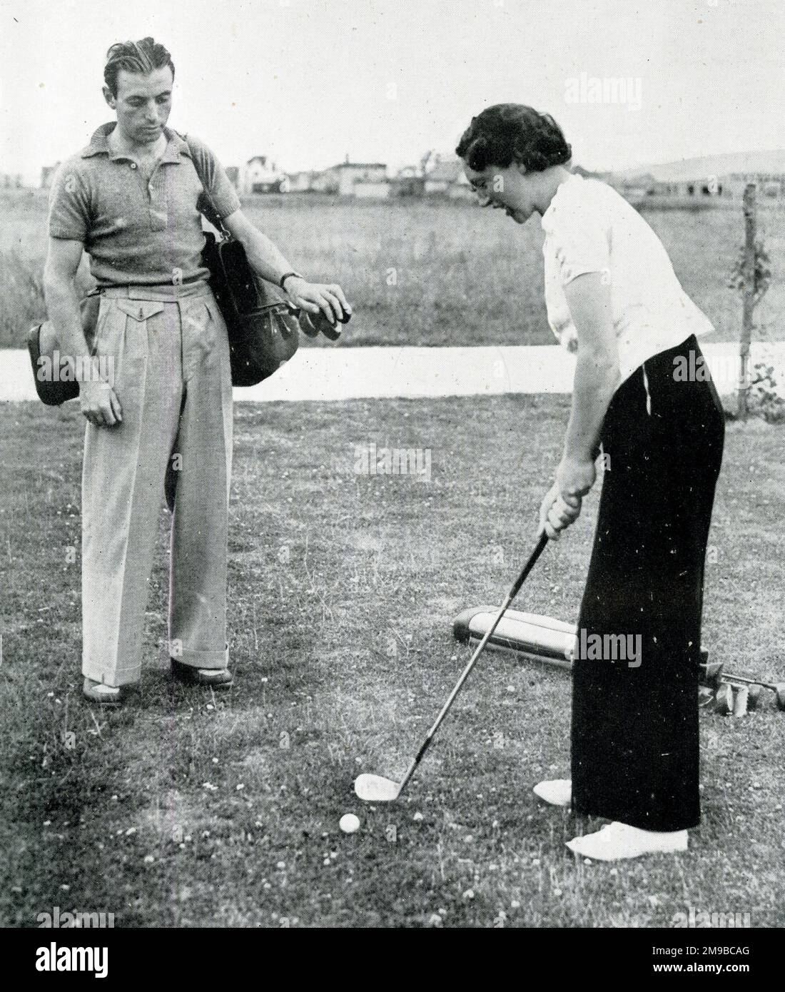 Stanley Matthews footballer for Stoke City playing golf with his wife ...