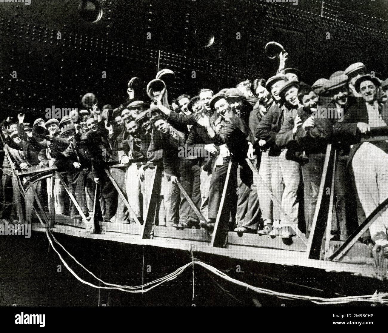 Shipyard workers cheering King Edward VIII on his visit to inspect the ...