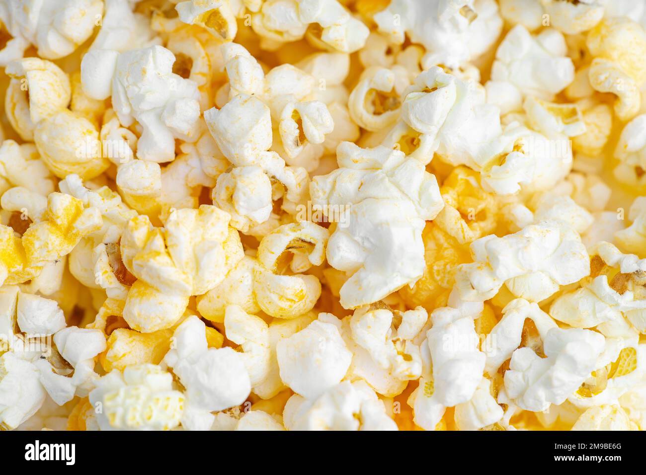 Scattered tasty cheese popcorn texture background. Fast food, movie ...