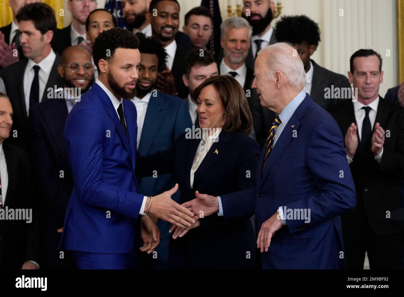 President Joe Biden shakes hands with Stephen Curry as Vice President ...