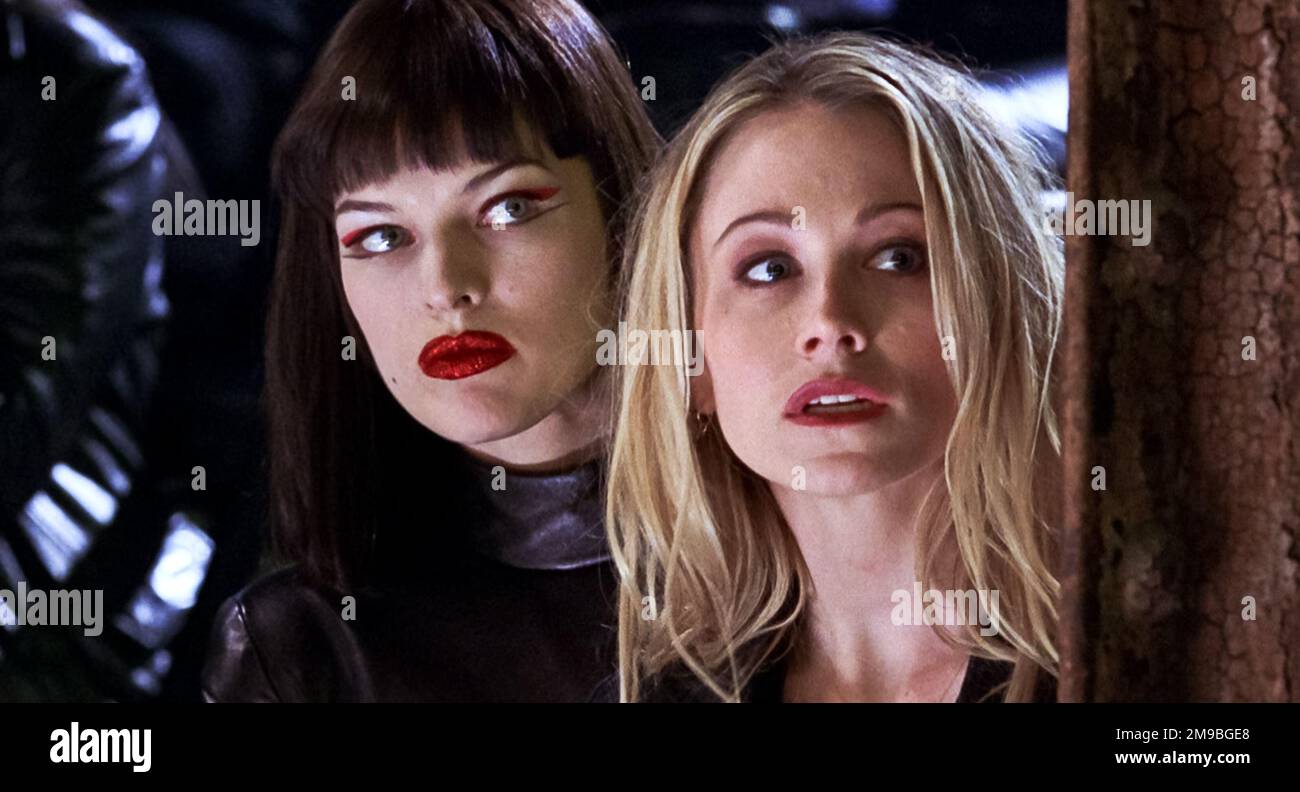 USA. Christine Taylor and Milla Jovovichin a scene from the (C ...
