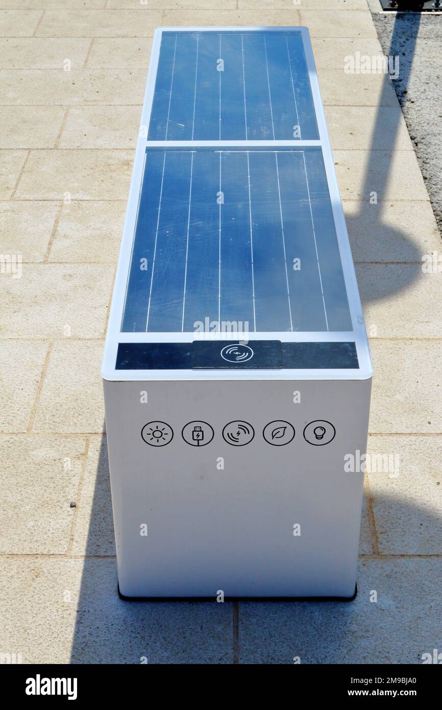 a smart solar powered charging bench Stock Photo - Alamy
