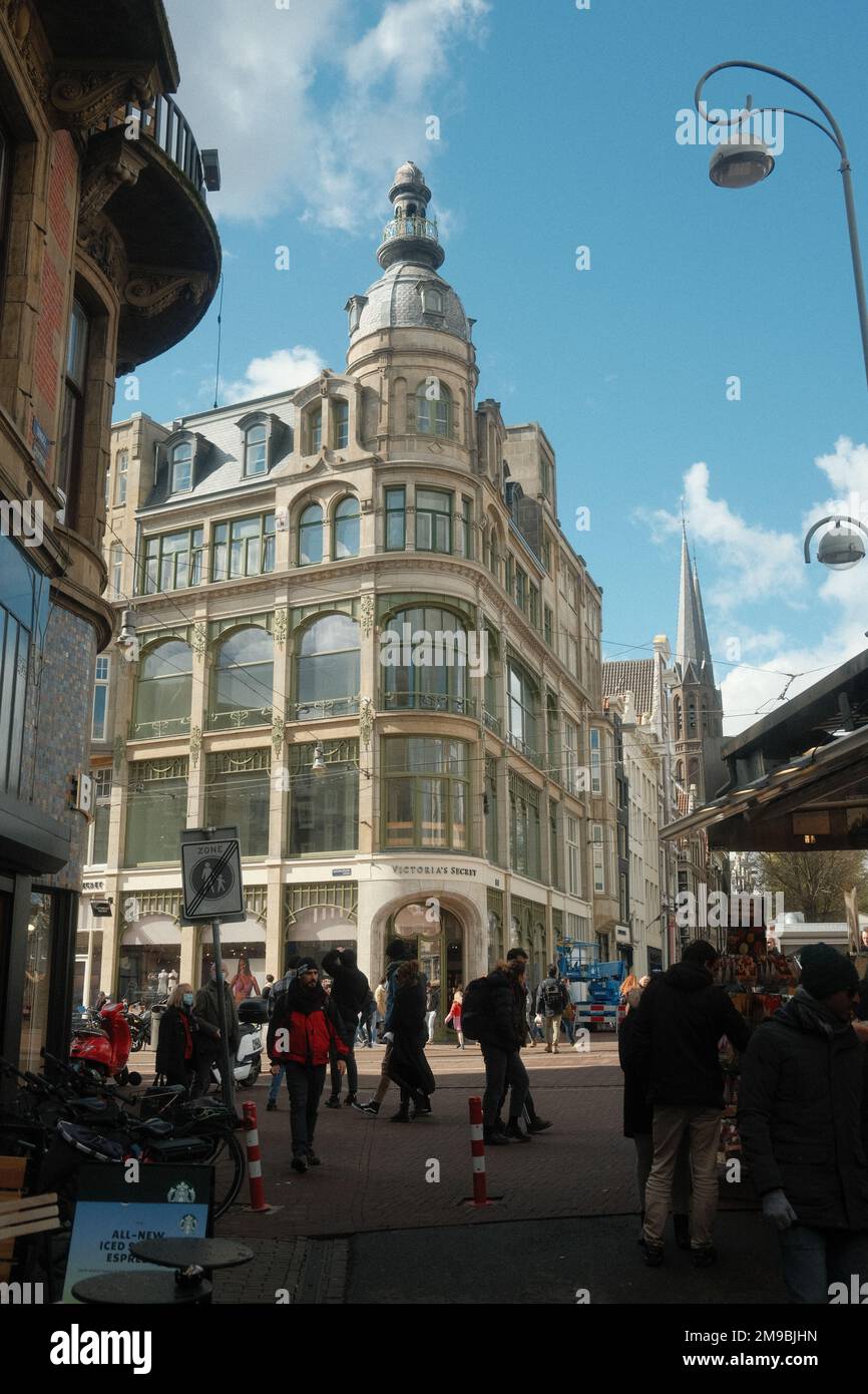 A vertical shot of people walking on the square of Koningsplein Stock ...