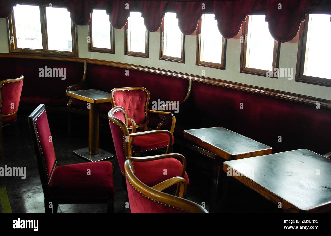 Empty chairs and table in a passenger ship Stock Photo - Alamy