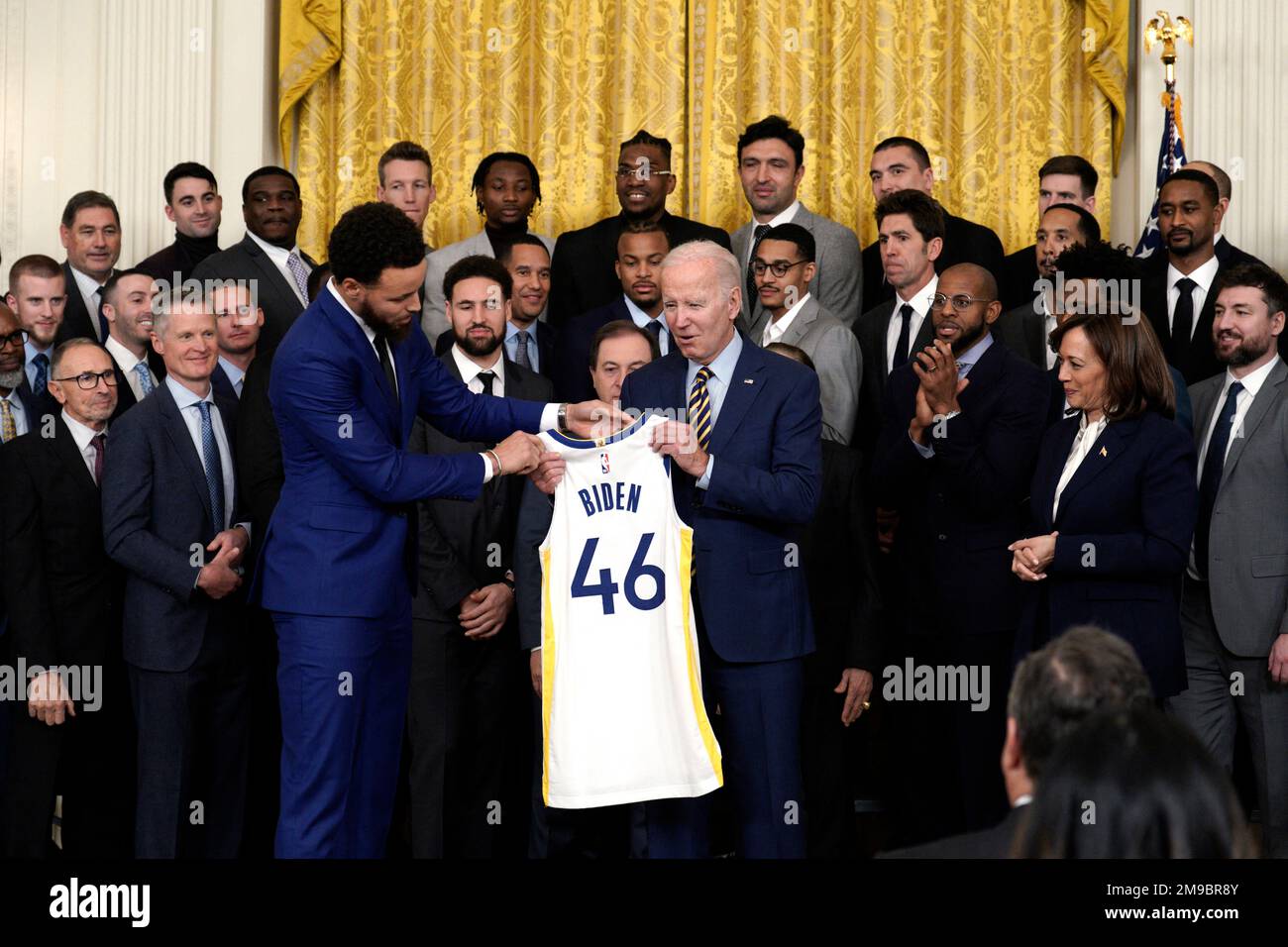 U.S. President Joe Biden is presented a jersey as he welcomes the ...